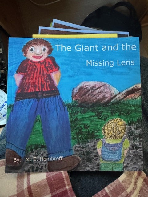 The Giant and The Missing Lens – The Vault Cultural Collective